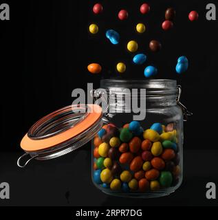 colorful candies falling Stock Photo - Alamy