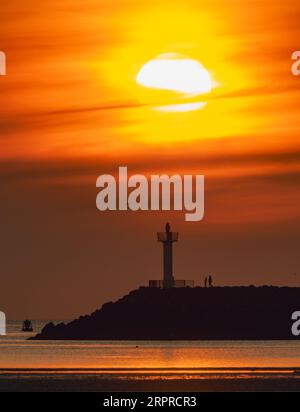 Howth sunrise from Claremont Beach Stock Photo - Alamy