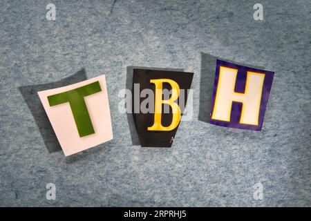 The acronym "TBH" (To Be Honest) using cut-out paper letters in the ...