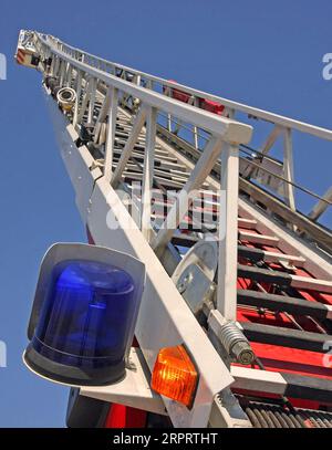 very long metal ladder of the fire truck ladder during exercise Stock ...