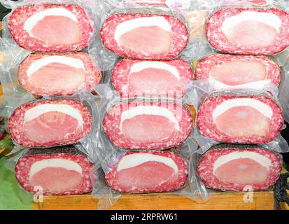 cold meats vacuum packed and on display in an open fridge in South ...