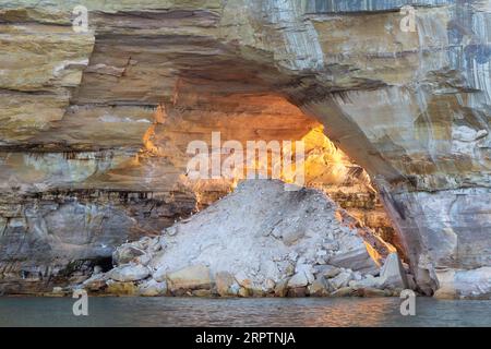 Birds on a portion of a collapsed natural arch along Pictured Rocks ...