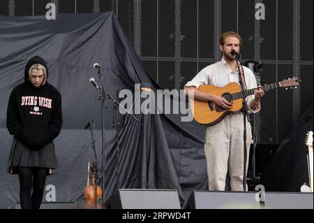 Photographs of Christian Lee Hutson and Phoebe Bridgers performing at ...