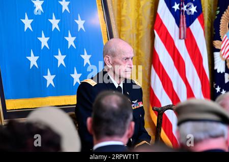 U.S. Army Captain Larry Taylor tears up as President Joe Biden speaks ...