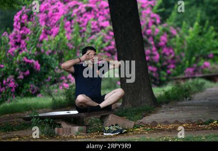 A man performs yoga on International Yoga Day in Lalitpur, Nepal ...