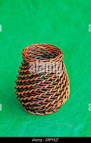 rattan weaving objects on green background Stock Photo - Alamy