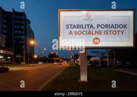 Bratislava, Slovakia. 26th Aug, 2023. People walk past the election ...