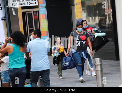 People walk in Times Square, Manhattan, New York City Stock Photo - Alamy