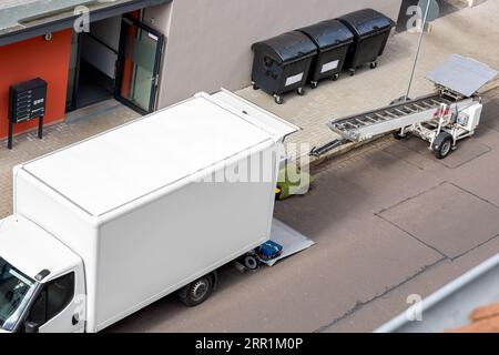 Mover service lifting ladder cargo crane platform vehicle van parked at ...