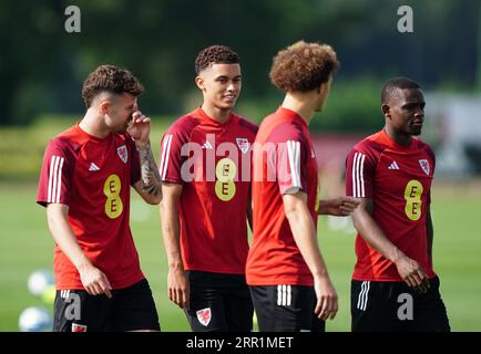 Wales' Brennan Johnson (right) and Neco Williams (left) during a ...
