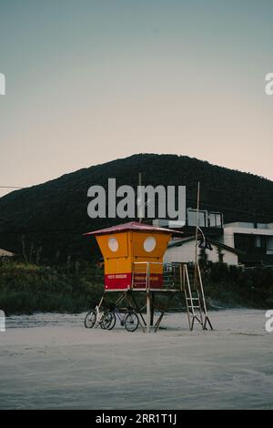 Red and Orange lifeguard tower under an overcast sky in Miami Beach ...