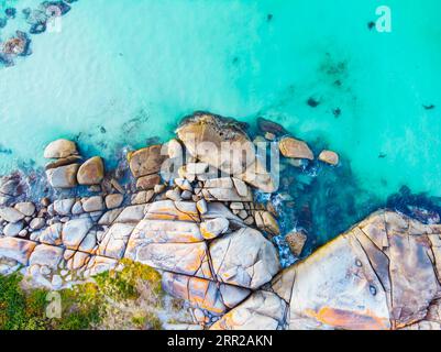An aerial view of the iconic lichen covered rocks and turqoise ocean ...