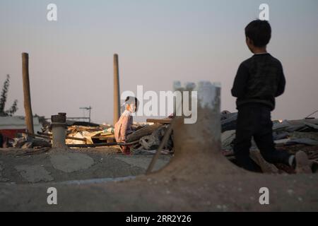 201017 -- TEHRAN, Oct. 17, 2020 -- Children play in a slum on the ...