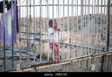 201017 -- TEHRAN, Oct. 17, 2020 -- Children play in a slum on the ...