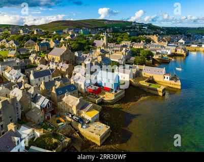 Aerial view of Stromness waterfront in early morning light on West ...