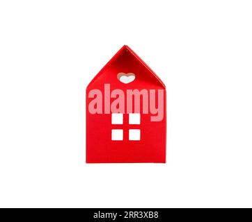 Little house cut out of paper in hand in view Stock Photo - Alamy