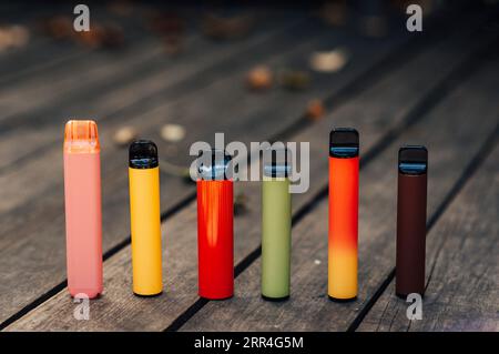 Vaping devices. Set of colorful electronic cigarettes. Electronic ...