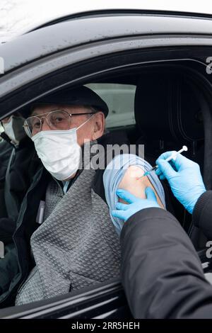 A man receives the Johnson & Johnson COVID-19 vaccine at a vaccination ...