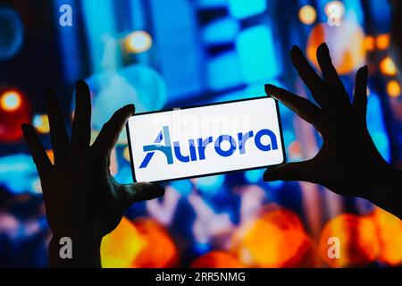 In this photo illustration, the Aurora Innovation logo is displayed on ...