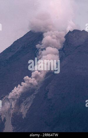 Mount Merapi spews volcanic materials as seen from Kimpulan Village ...