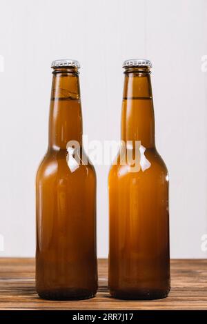 Close-up of two beer bottles with a slice of lemon Stock Photo - Alamy