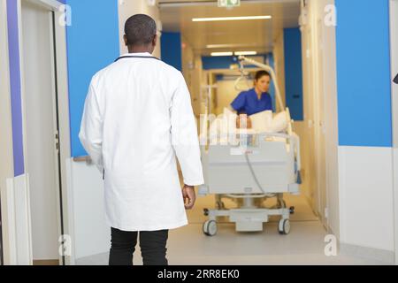 patient hospital bed moved by medical staff to operating room Stock ...