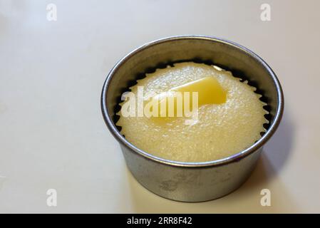 Puto cupcake in an aluminum mold. Hulmahan ng puto Stock Photo - Alamy
