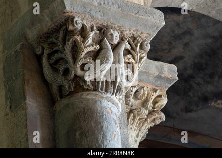 Mozac. Capitals of Saint-Pierre Abbey Church outdoors. Puy de Dome ...