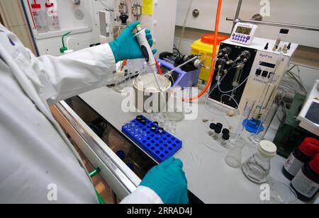 GENERIC STOCK... Staff work inside the AstraZeneca Laboratory in ...