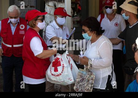 ATHENS, Aug. 3, 2021: A volunteer from the Hellenic Red Cross ...