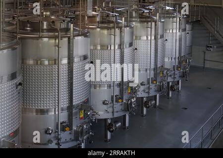 Modern stainless steel wine vats, winery interior Stock Photo - Alamy