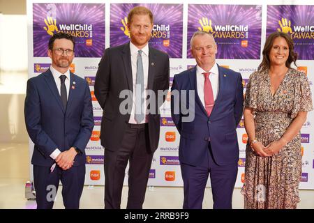 WellChild CEO Matt James, left, Britain's Prince Harry, Craig Hatch ...