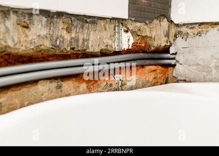 installation of new polyethylene flexible plumbing pipes in chiseled ...