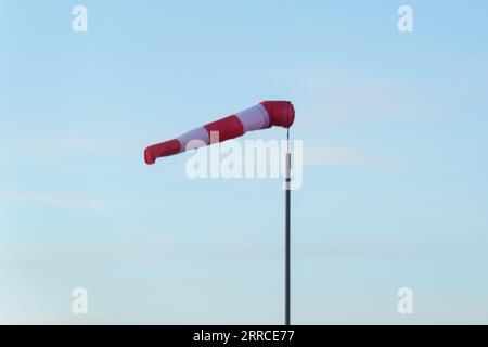 A red and white wind cone indicating the direction and strength of the ...