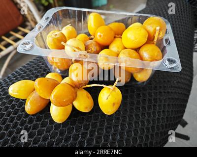 cluster of fresh ripe yellow date Stock Photo - Alamy