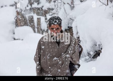 A man walks amid heavy snowfall as snowfall contimues for third day in ...
