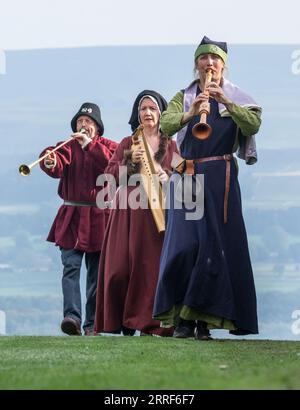 Musicians with their 15th century instruments left to tight Lizzie ...