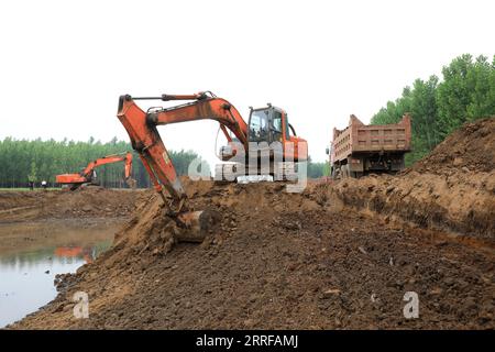 Excavator in construction of water conservancy project, North China ...