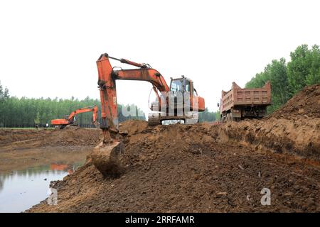 Excavator in construction of water conservancy project, North China ...
