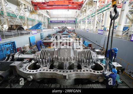 220416 -- HARBIN, April 16, 2022 -- Workers work at a factory of Harbin ...