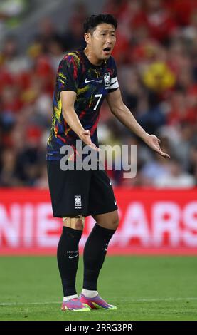Son Heung-Min of Korea Republic (R) runs with the ball during a FIFA ...