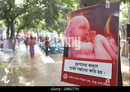 220531 -- DHAKA, May 31, 2022 -- An anti-tobacco awareness poster is ...