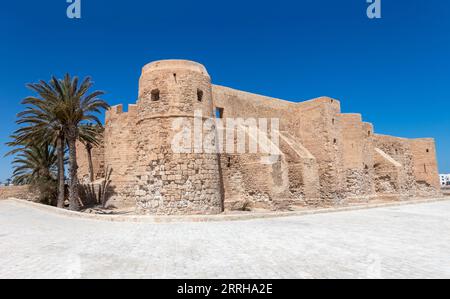 Medieval fortress Bordj El Kebir at Mediterranean coast of Tunisia near ...