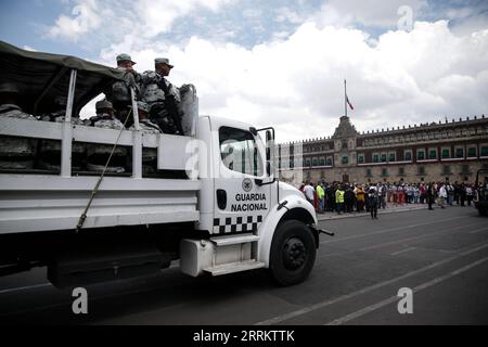 Members of the Mexican National Guard patrol along the border wall ...