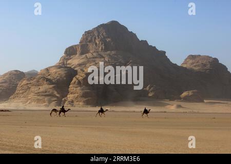 220930 -- AMMAN, Sept. 30, 2022 -- Camels compete during a camel race ...