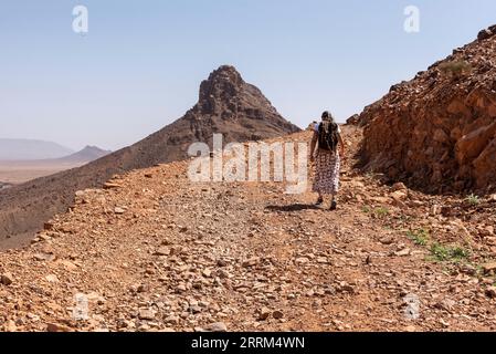 Hiking up the mount Zagora on a gravel road, mount Adafane in the ...