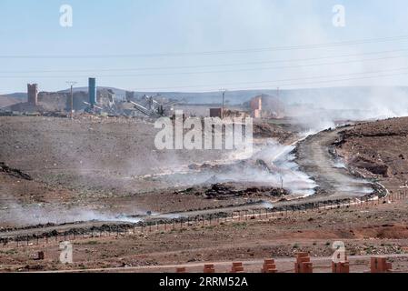 Trash being burned beside the road near the Draa valley in Morocco ...
