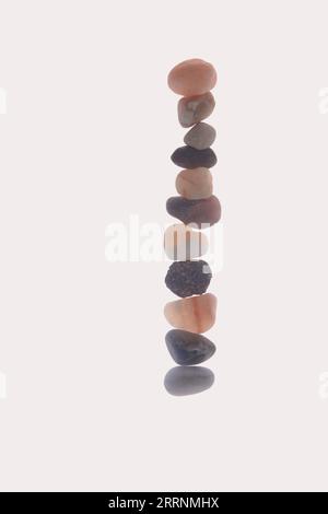 Letter F handcrafted using small stones or pebbles, single object ...