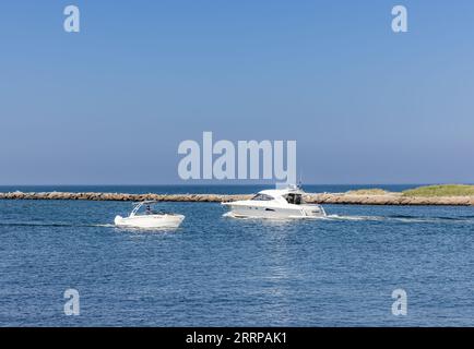 two boats passing in the montauk inlet Stock Photo - Alamy