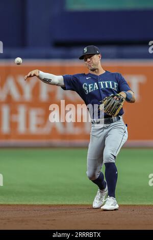 Seattle Mariners' Dylan Moore, left, celebrates with first base coach ...
